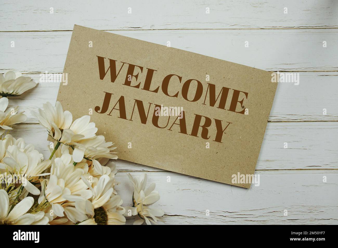 Welcome January card and flower bouquet on wooden background Stock ...
