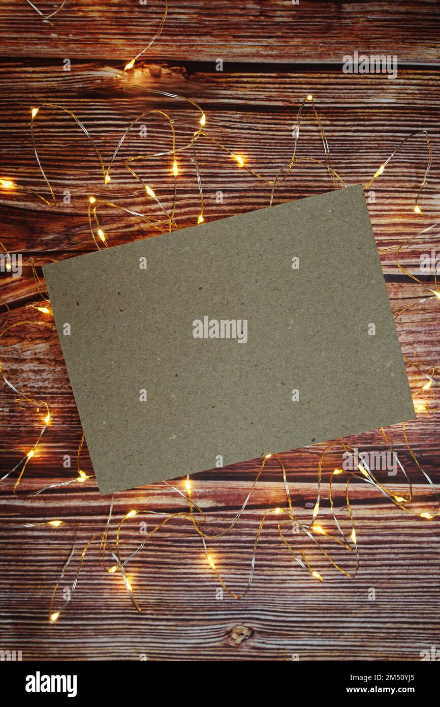 Empty paper craft with LED light on wooden background Stock Photo - Alamy