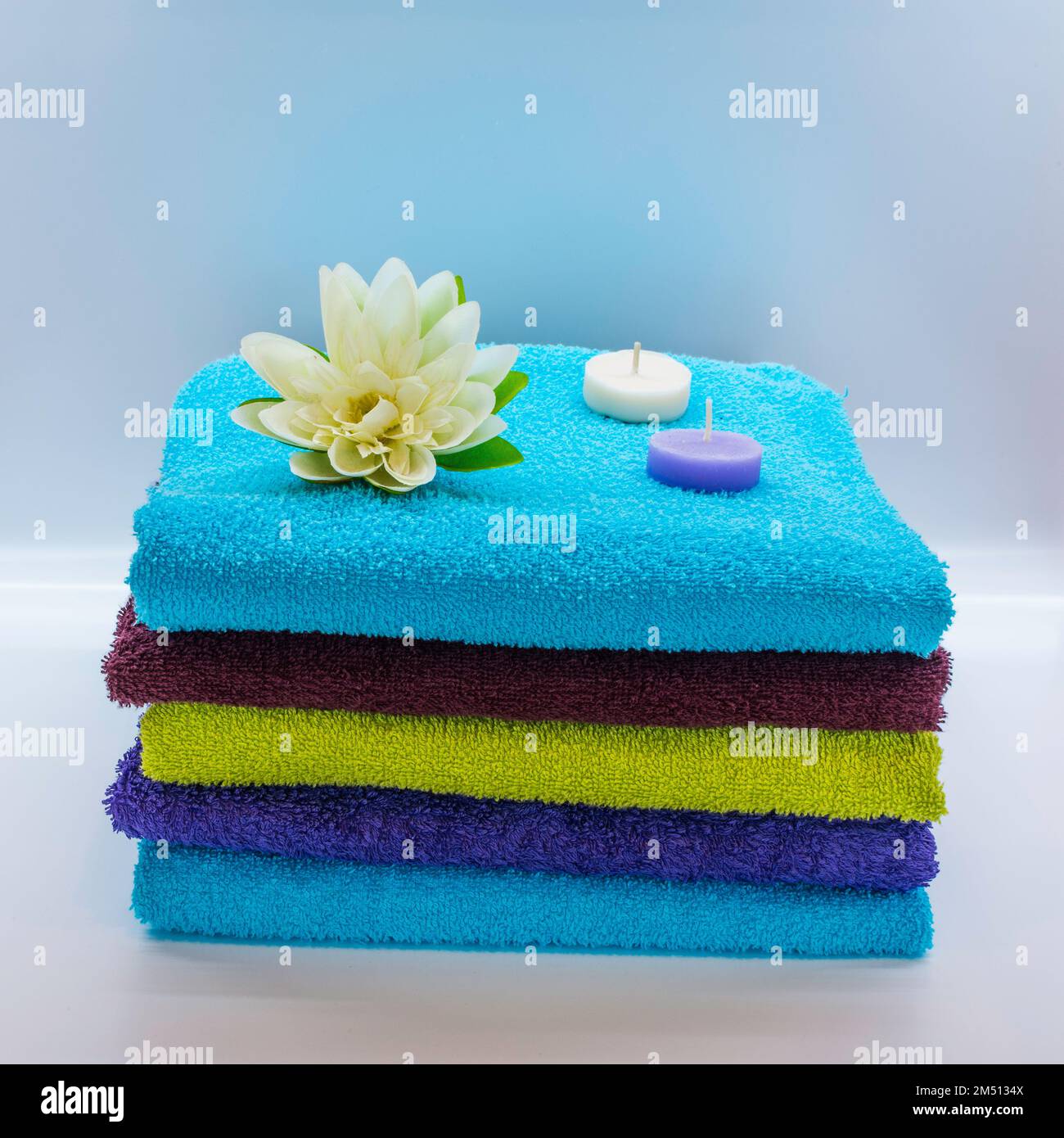 Colours towels in the natural and relax spa Stock Photo - Alamy