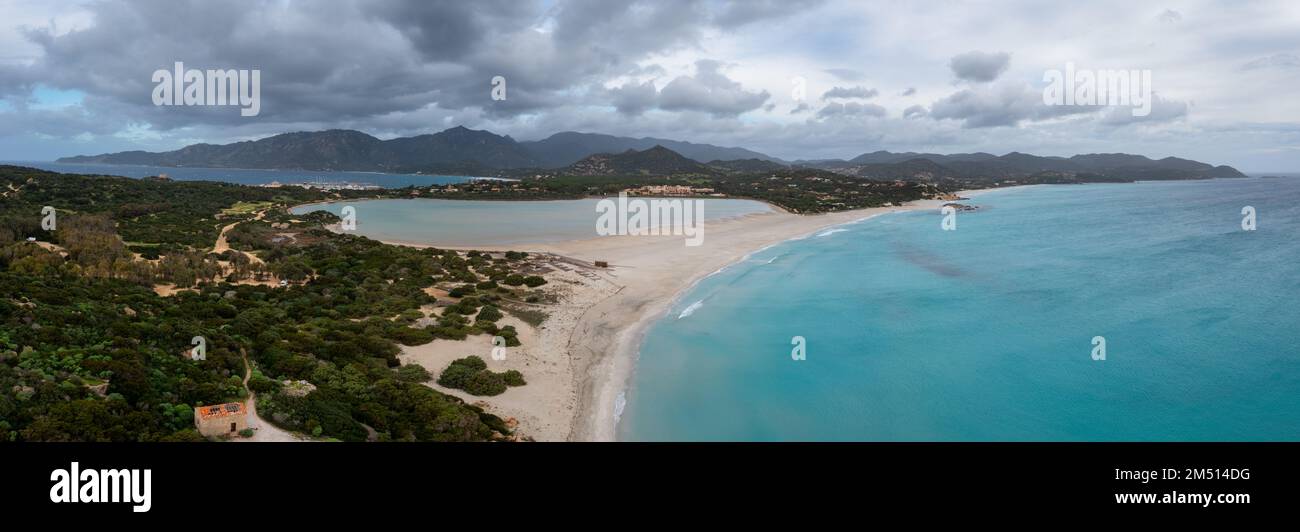 aerial panorama of Capo Carbonara and the beach and lake near ...