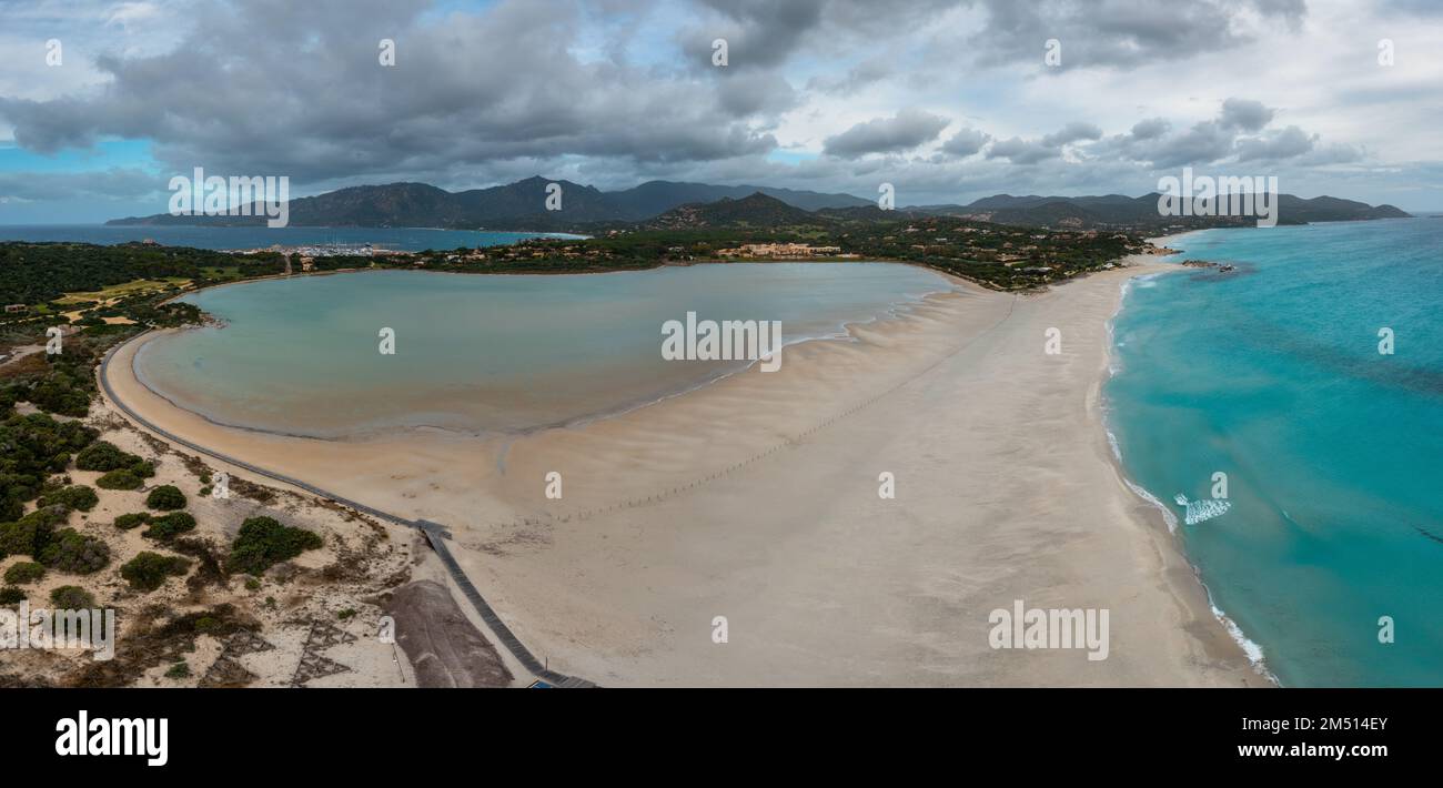 aerial panorama of Capo Carbonara and the beach and lake near ...