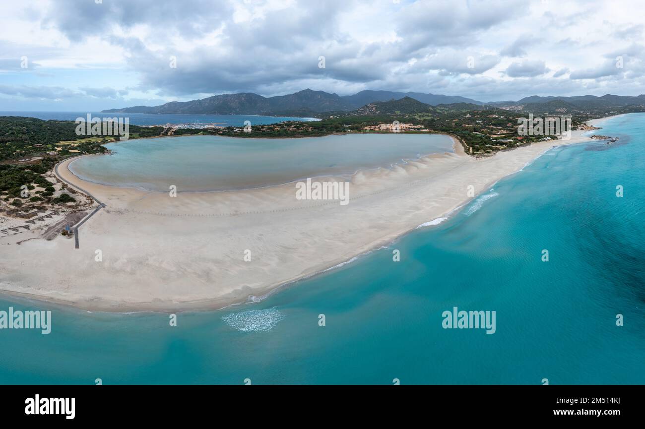 aerial panorama of Capo Carbonara and the beach and lake near ...
