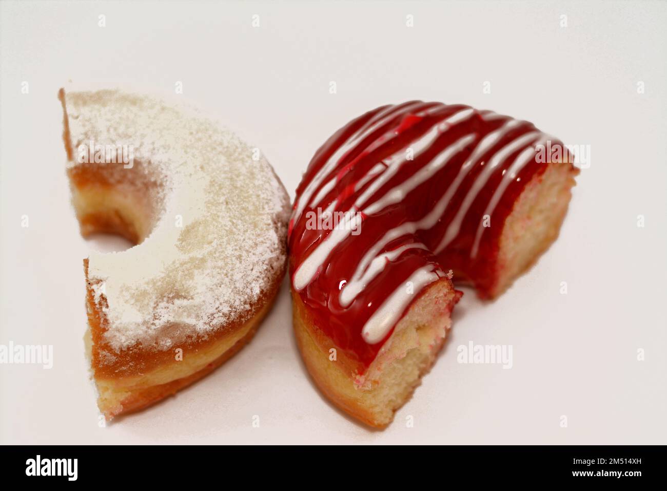 Icing powdered confectioners' sugar and Strawberry flavored ring donut ...