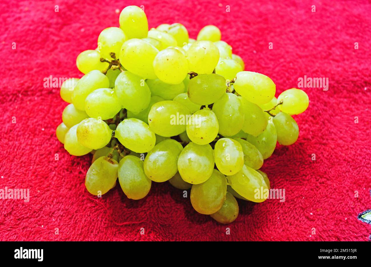 Green grapes on kitchen table Stock Photo - Alamy