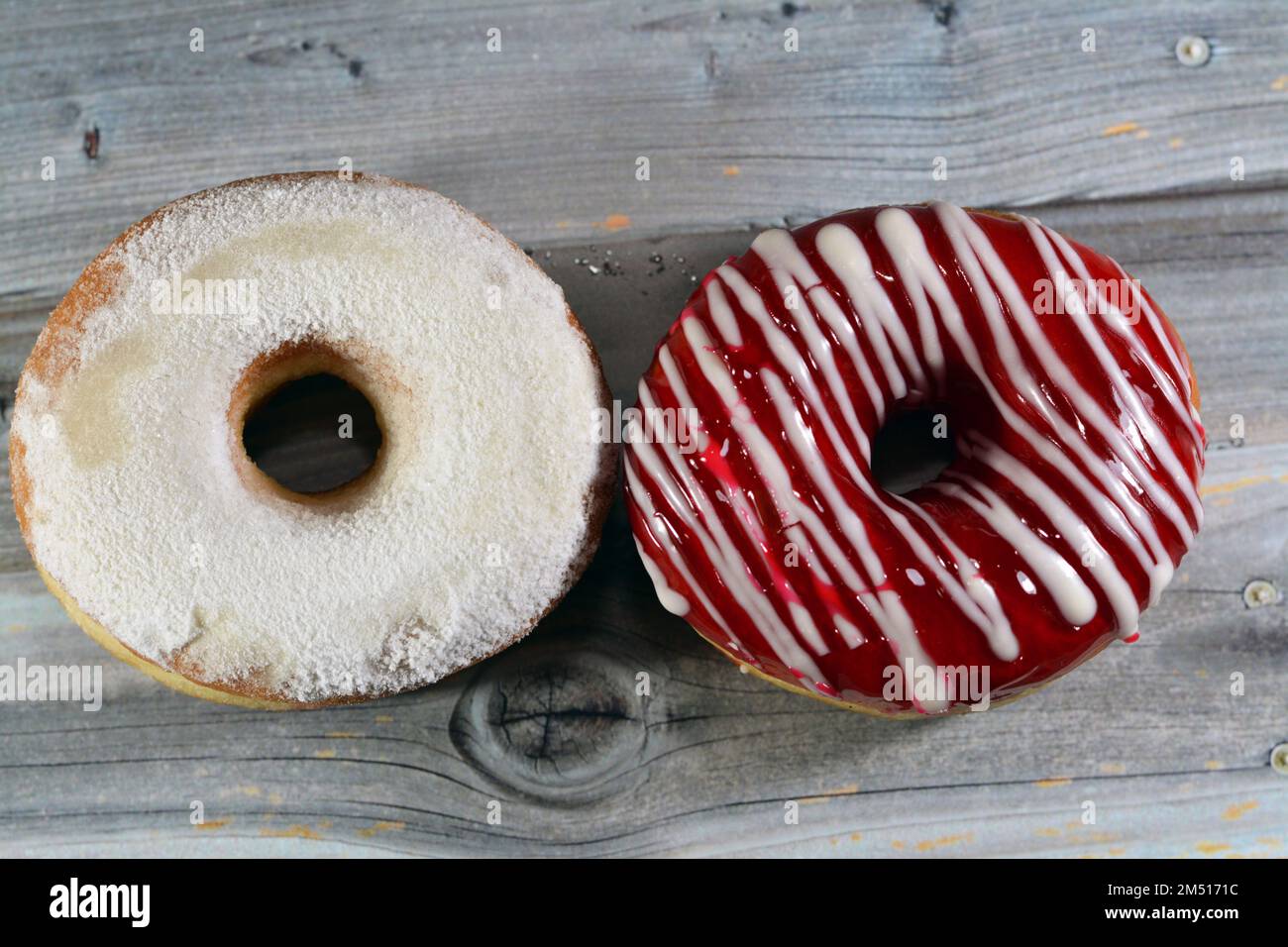 Icing powdered confectioners' sugar and Strawberry flavored ring donut ...