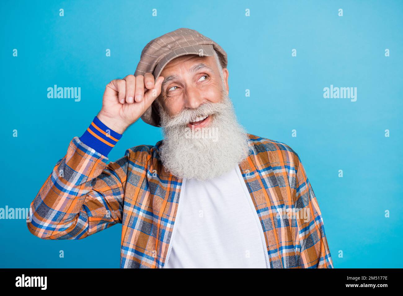 Photo of positive dreamy retired man dressed plaid suit arm cap looking ...