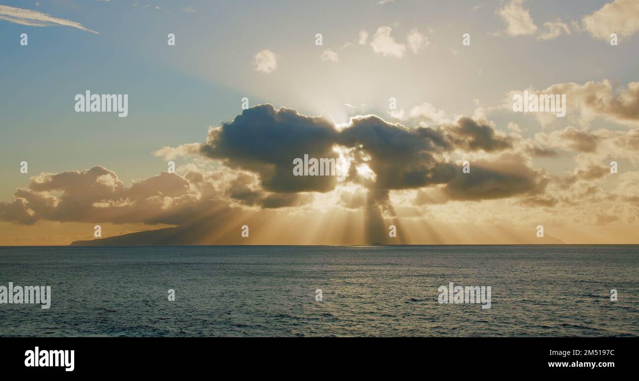 Bright sun light ray, sunbeam shining through colorful dark cumulus ...