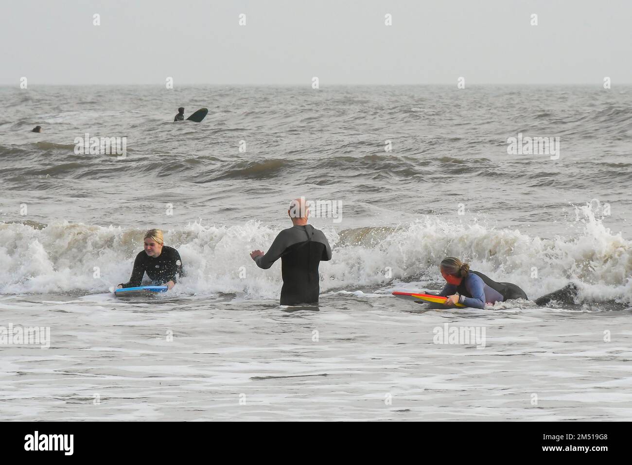 Lyme Regis, Dorset, UK. 24th December 2022. UK Weather. A family ...