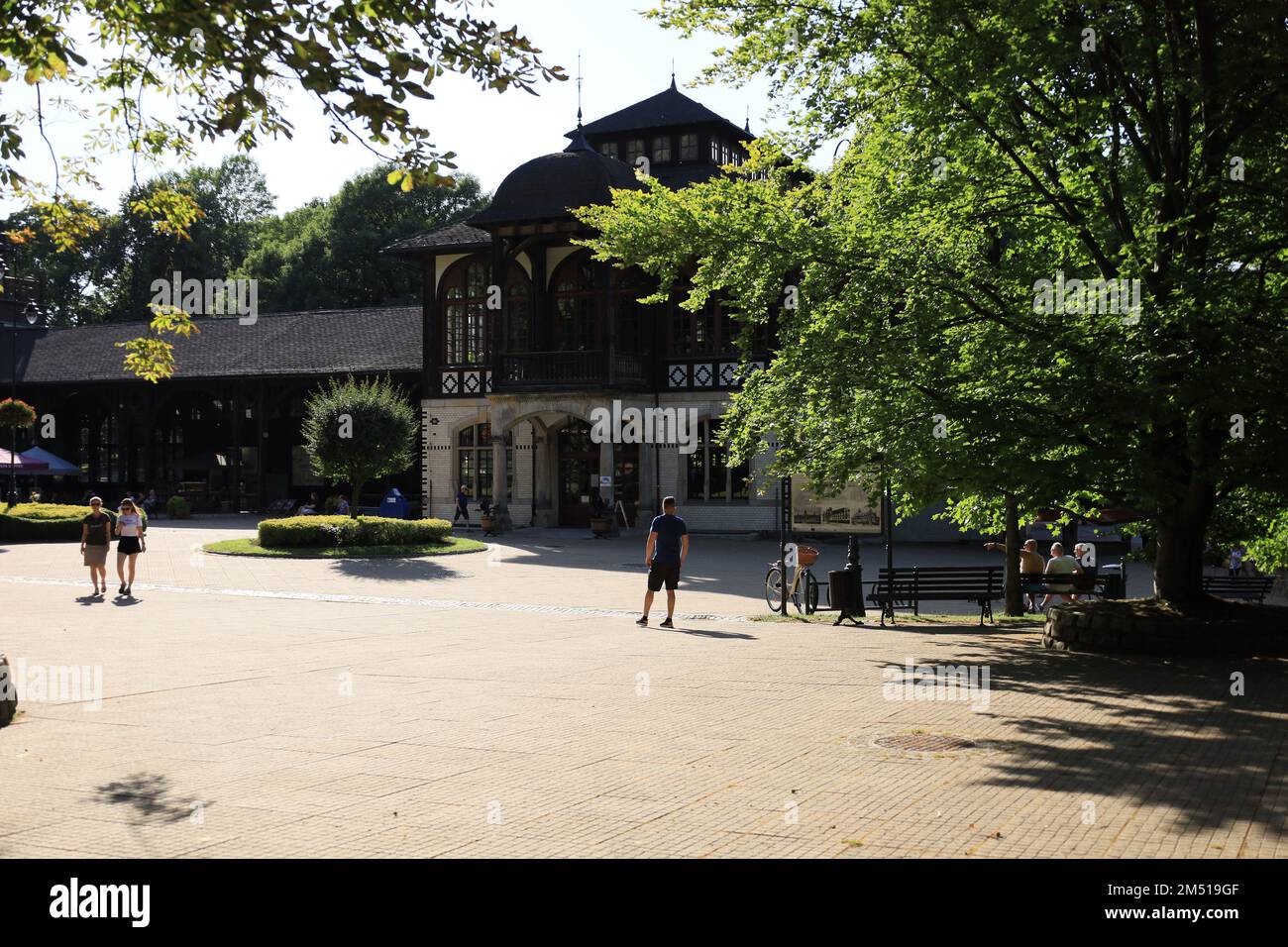 A beautiful view of the trees and buildings in Szczawno Zdroj park ...