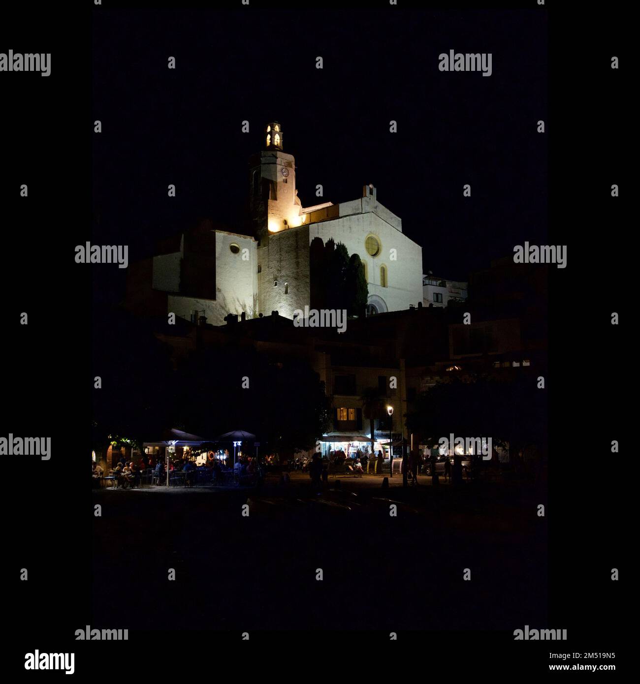 The illuminated Santa Maria de Cadaques church in Catalonia during a ...