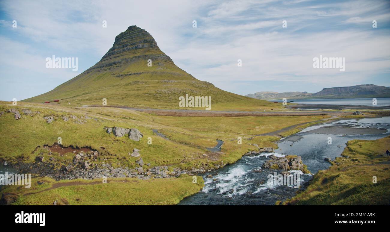 Green mountain peak and Kirkjufellsfoss fall is popular attractions at ...