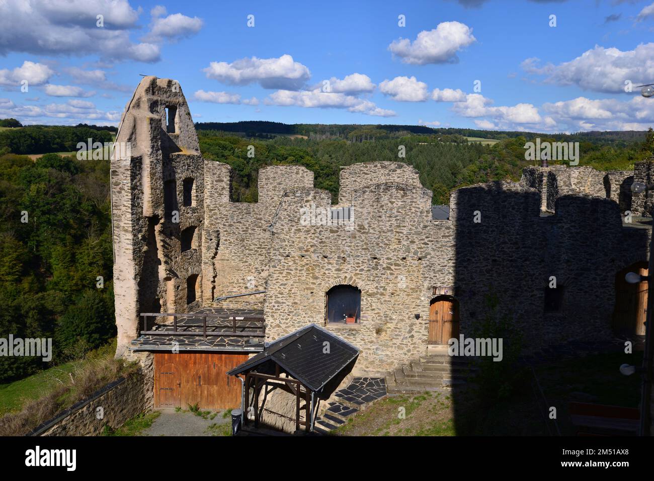 The old Freienfels Castle in Germany surrounded by green trees against ...