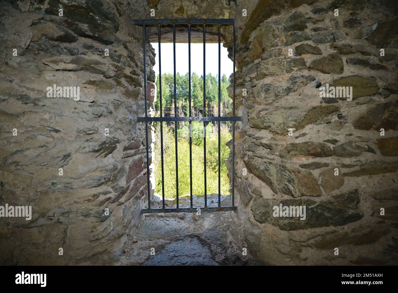 An old window with metal bars in the medieval Freienfels Castle in ...