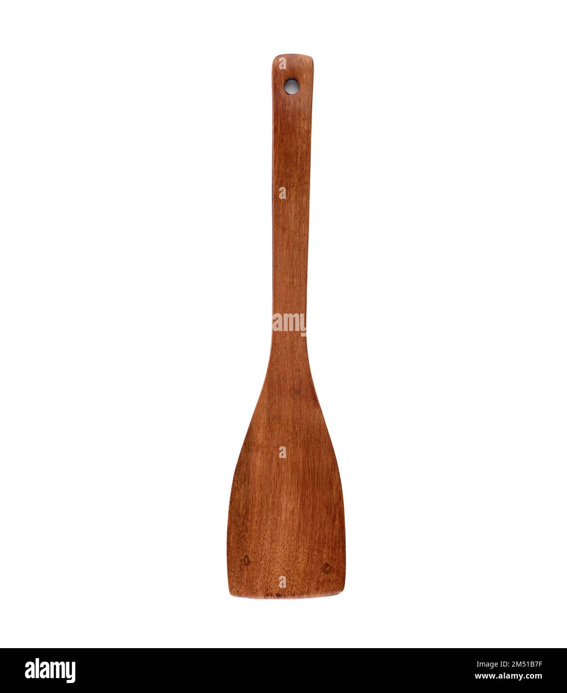 Long wooden kitchen spatula vertically on a white background. Copy ...