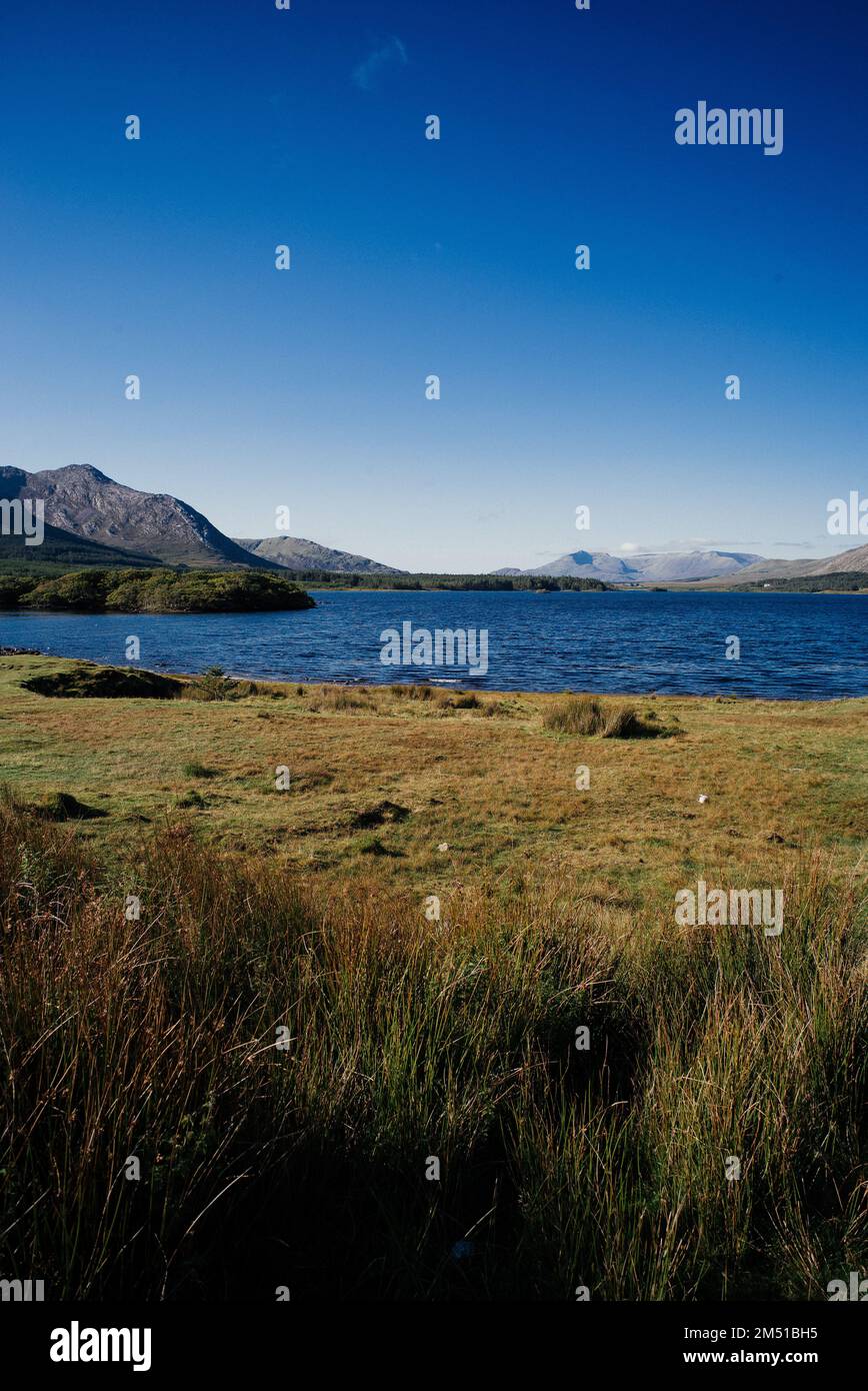 A vertical shot of the landscape at Connemara National Park in Ireland ...