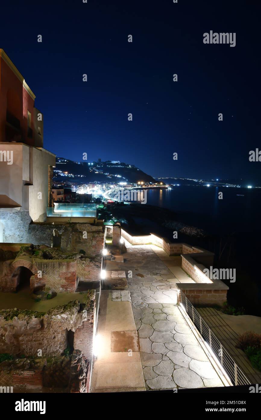 Ruins of an ancient Roman city on the seafront of Pozzuoli overlooking ...