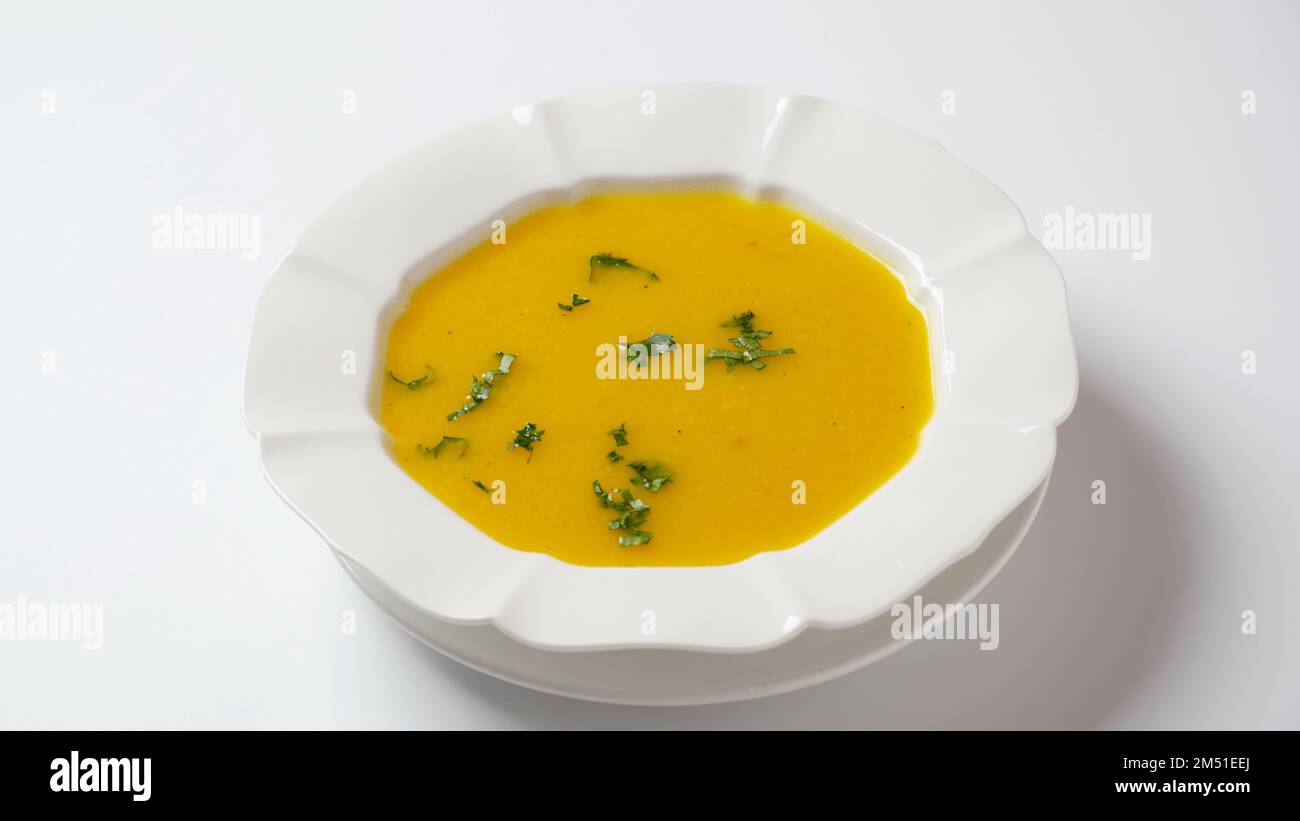 Pea soup with smoked pork ribs served in plate Stock Photo - Alamy