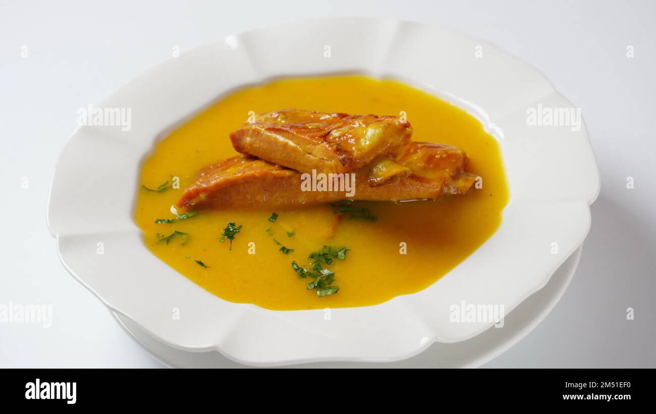 Pea soup with smoked pork ribs served in plate Stock Photo - Alamy