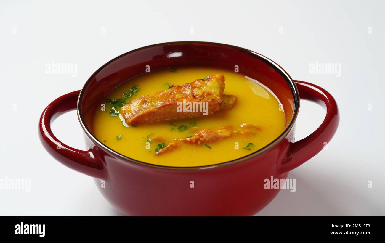 Pea soup with smoked pork ribs served in plate Stock Photo - Alamy