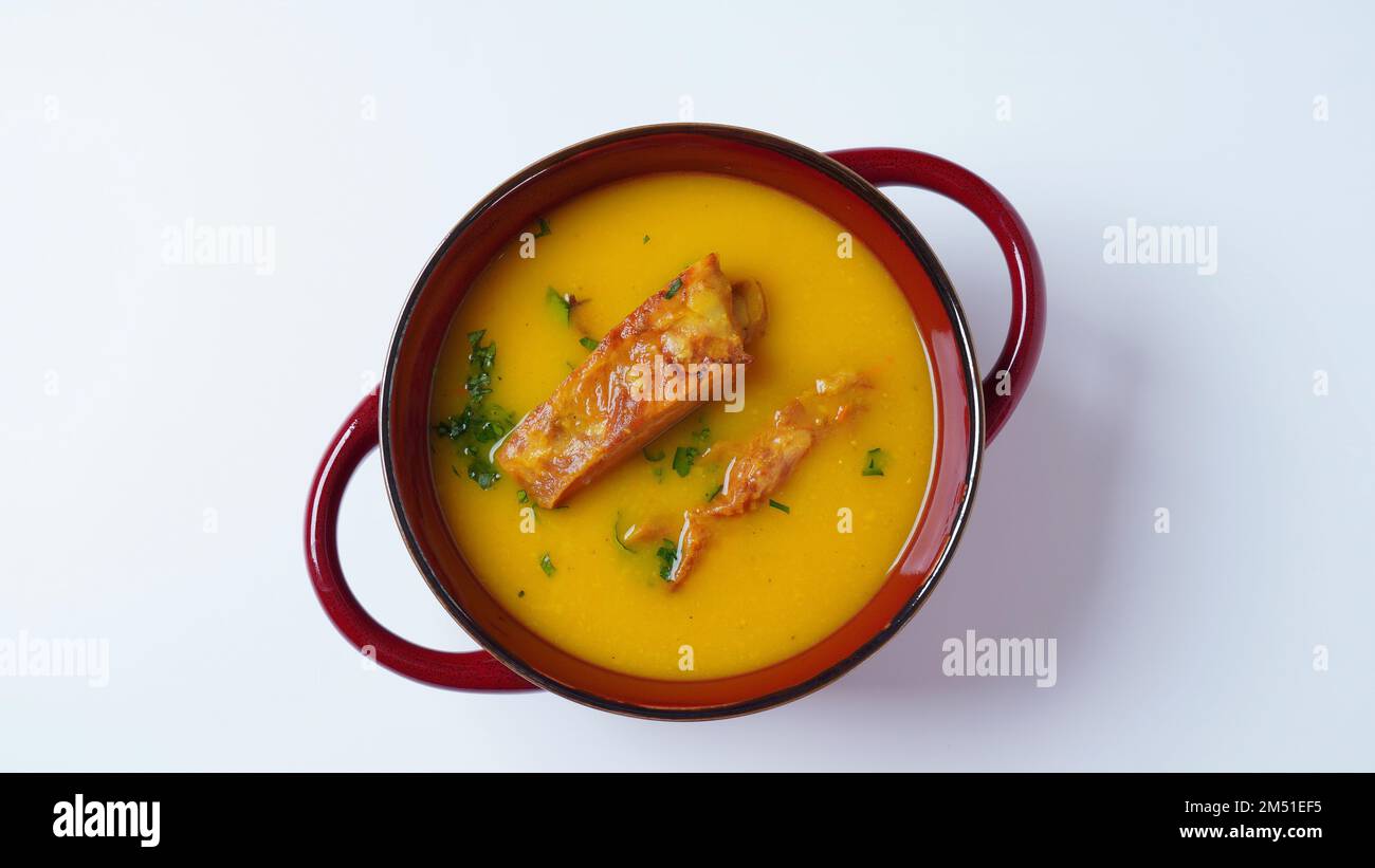 Pea soup with smoked pork ribs served in plate Stock Photo - Alamy