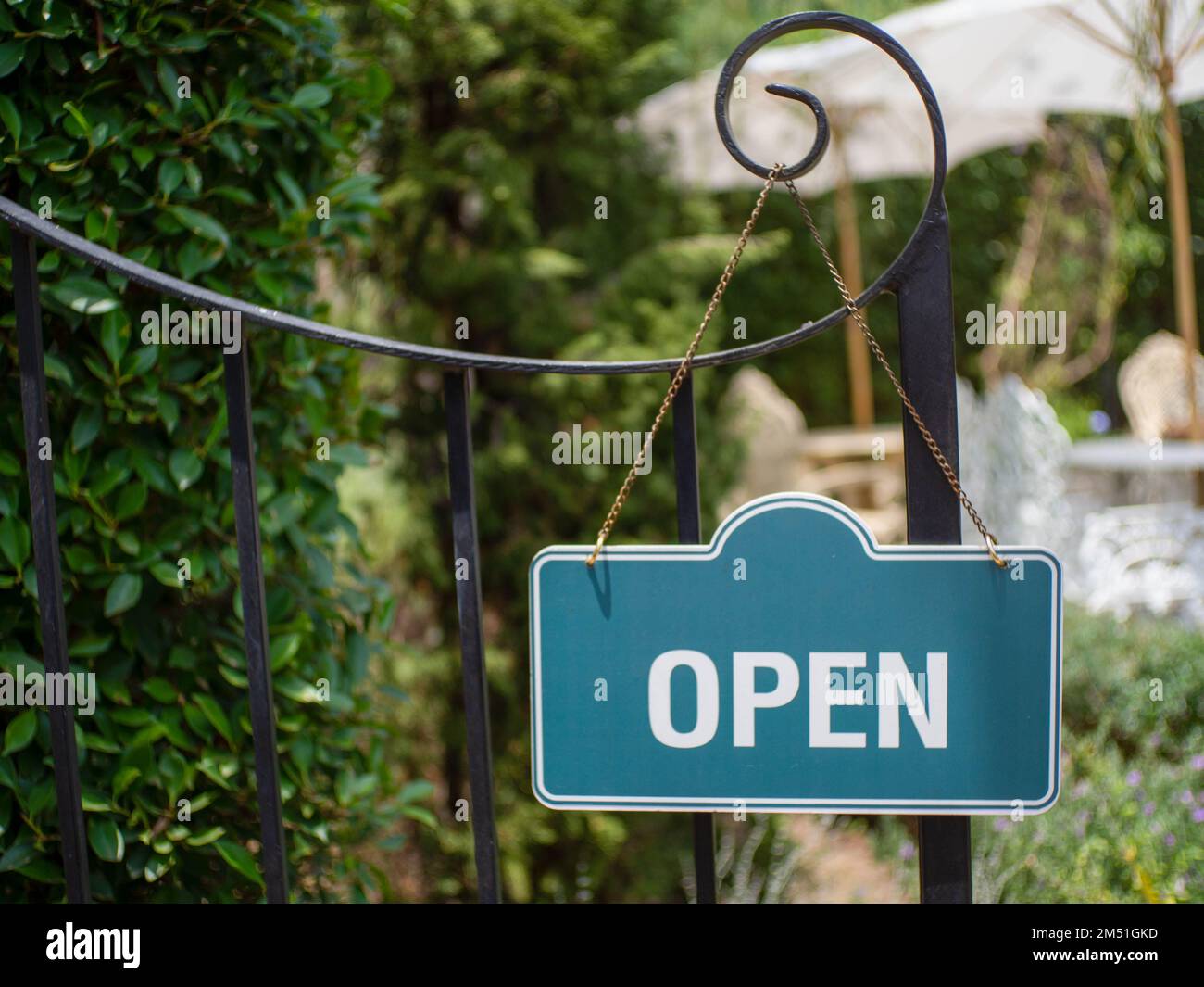 A blue sign with an open word Stock Photo - Alamy
