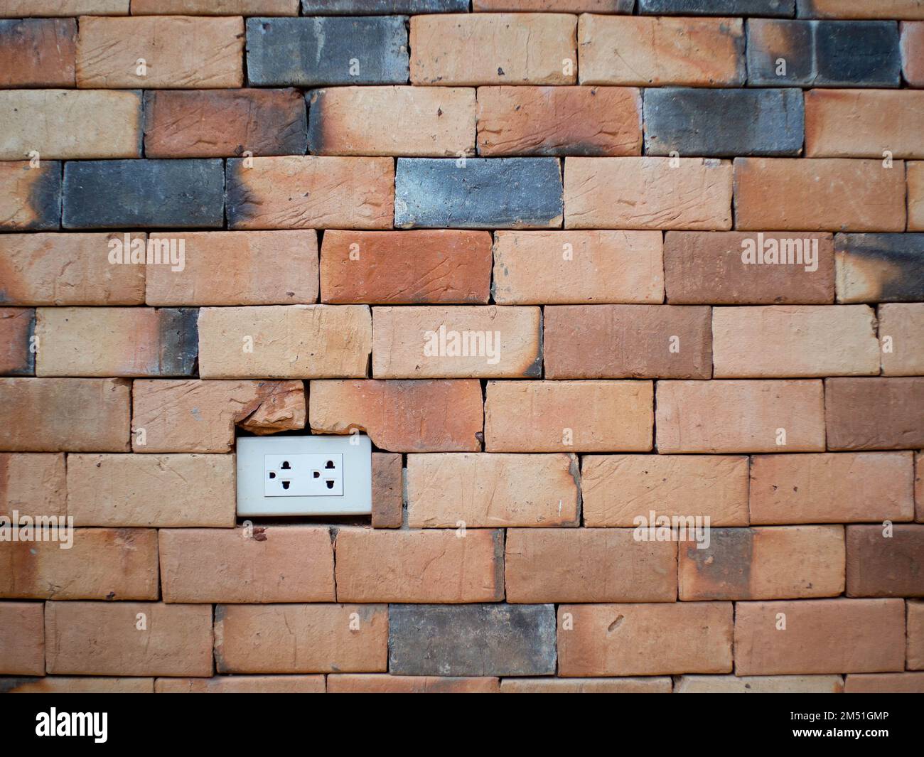power plug and red brick Stock Photo - Alamy