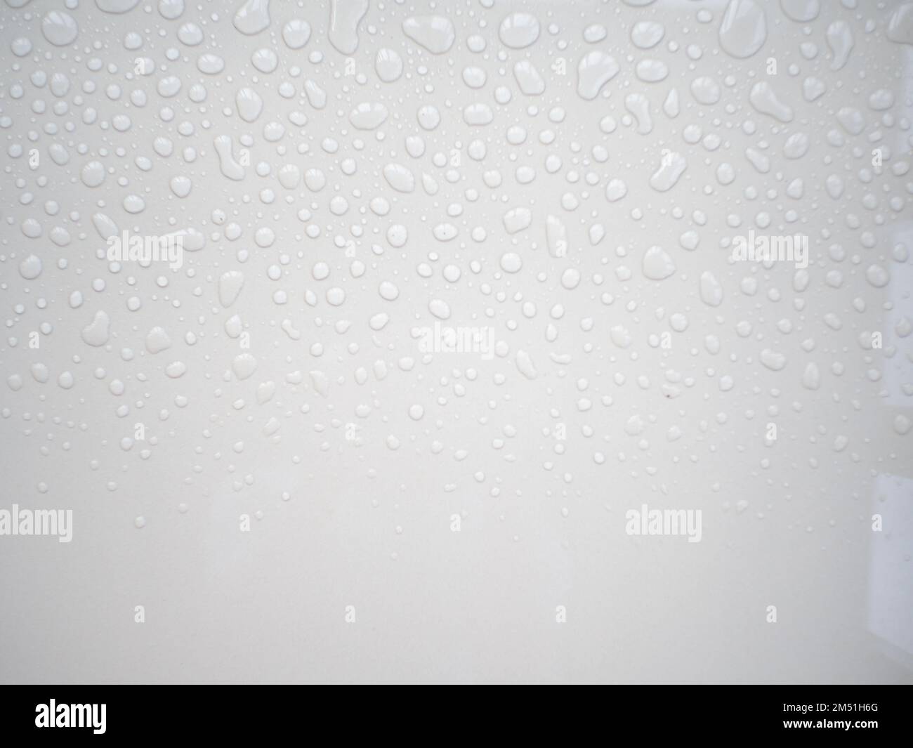 water droplets on white tiled floor Stock Photo - Alamy