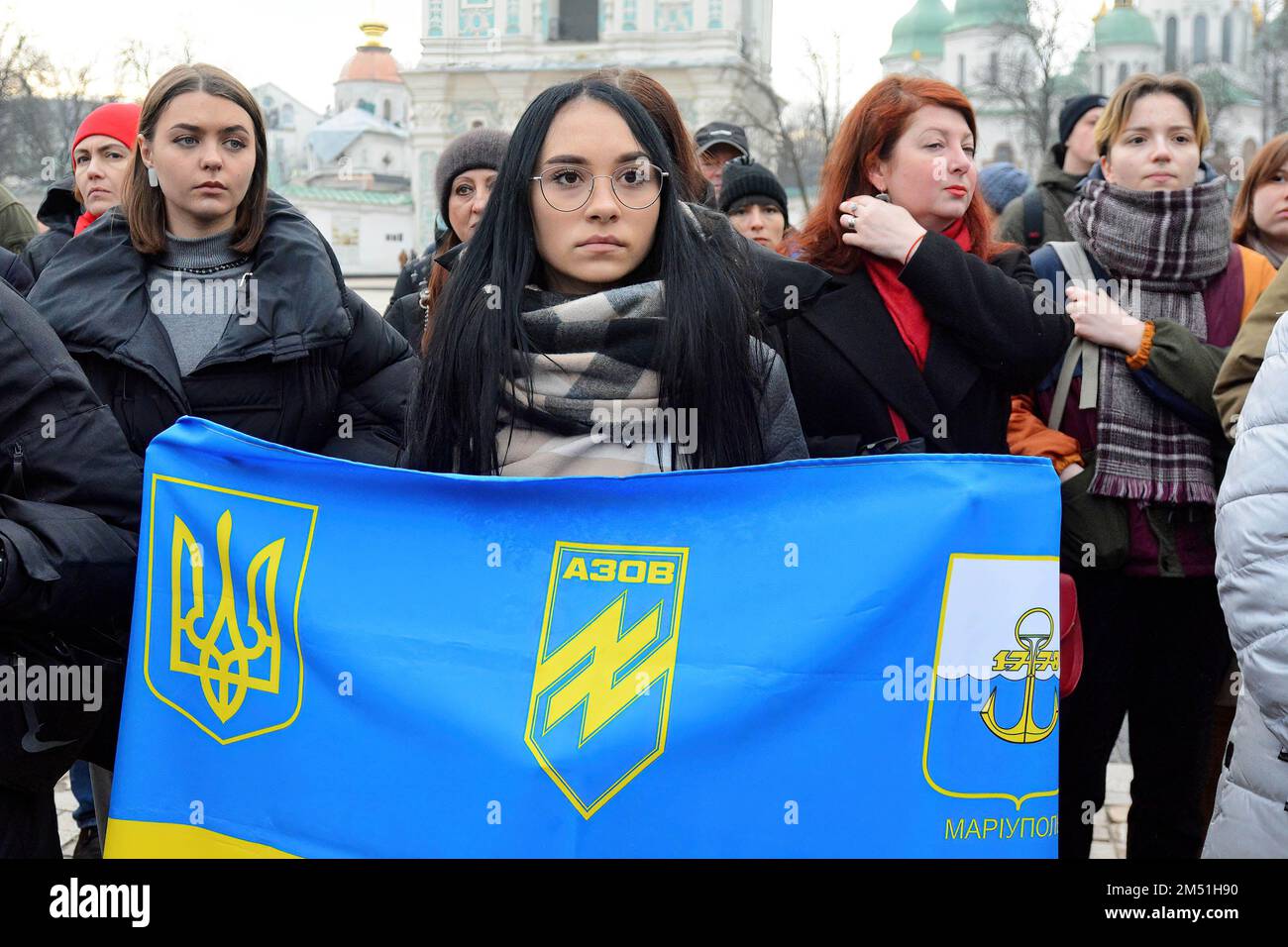 Kyiv, Ukraine. 24th Dec, 2022. A woman holds a flag with the symbols of ...