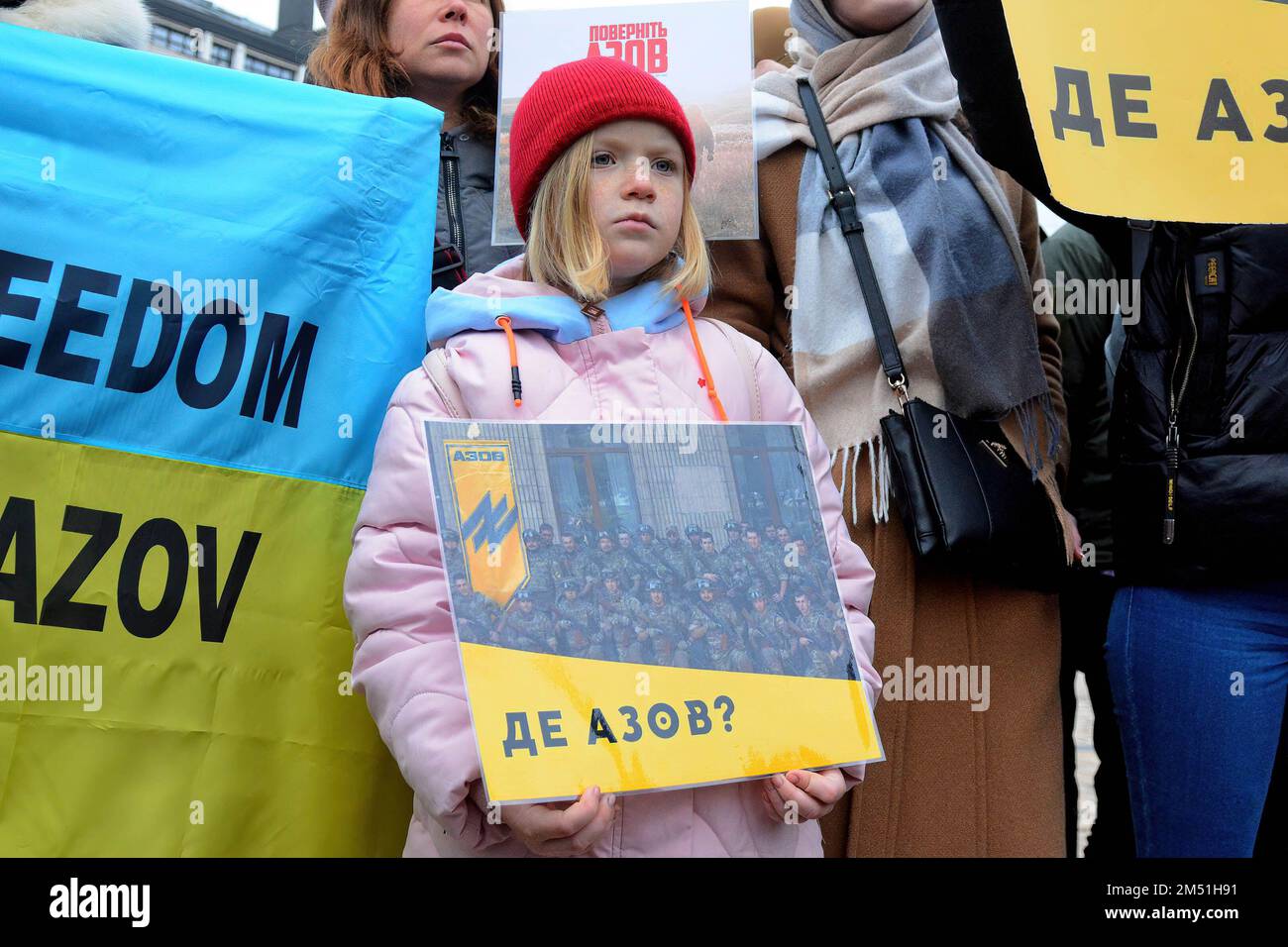 Kyiv, Ukraine. 24th Dec, 2022. A girl holds a placard expressing her ...