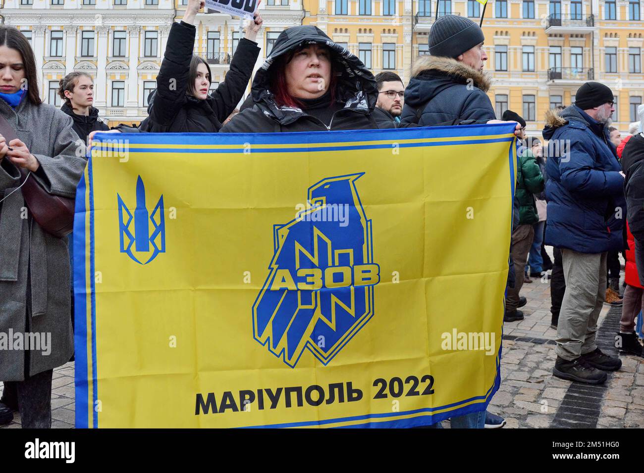 Kyiv, Ukraine. 24th Dec, 2022. A woman holds a flag with the symbols of ...