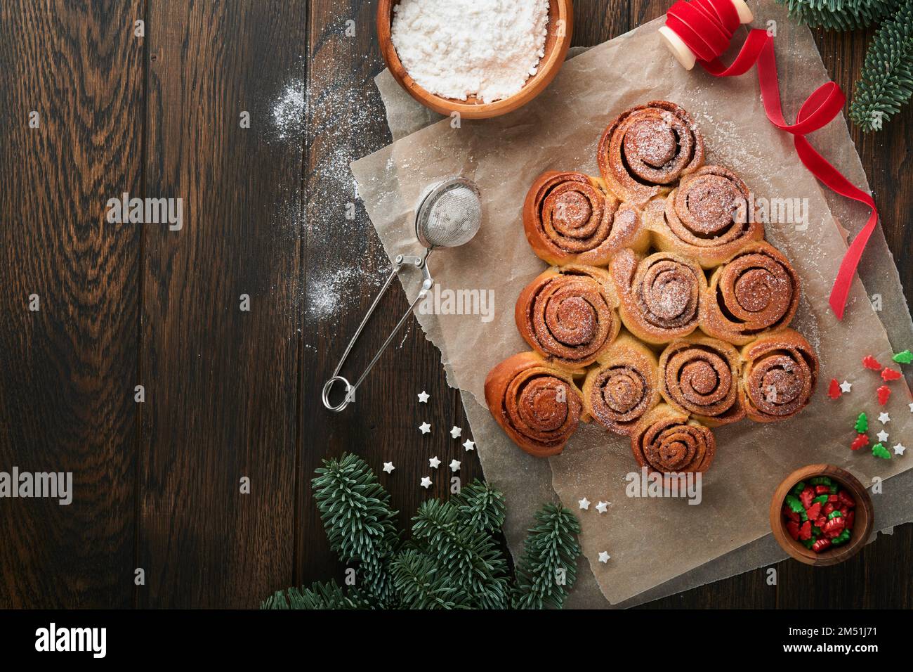 Christmas tree shape cinnamon rolls or cinnabon buns with cinnamon and ...