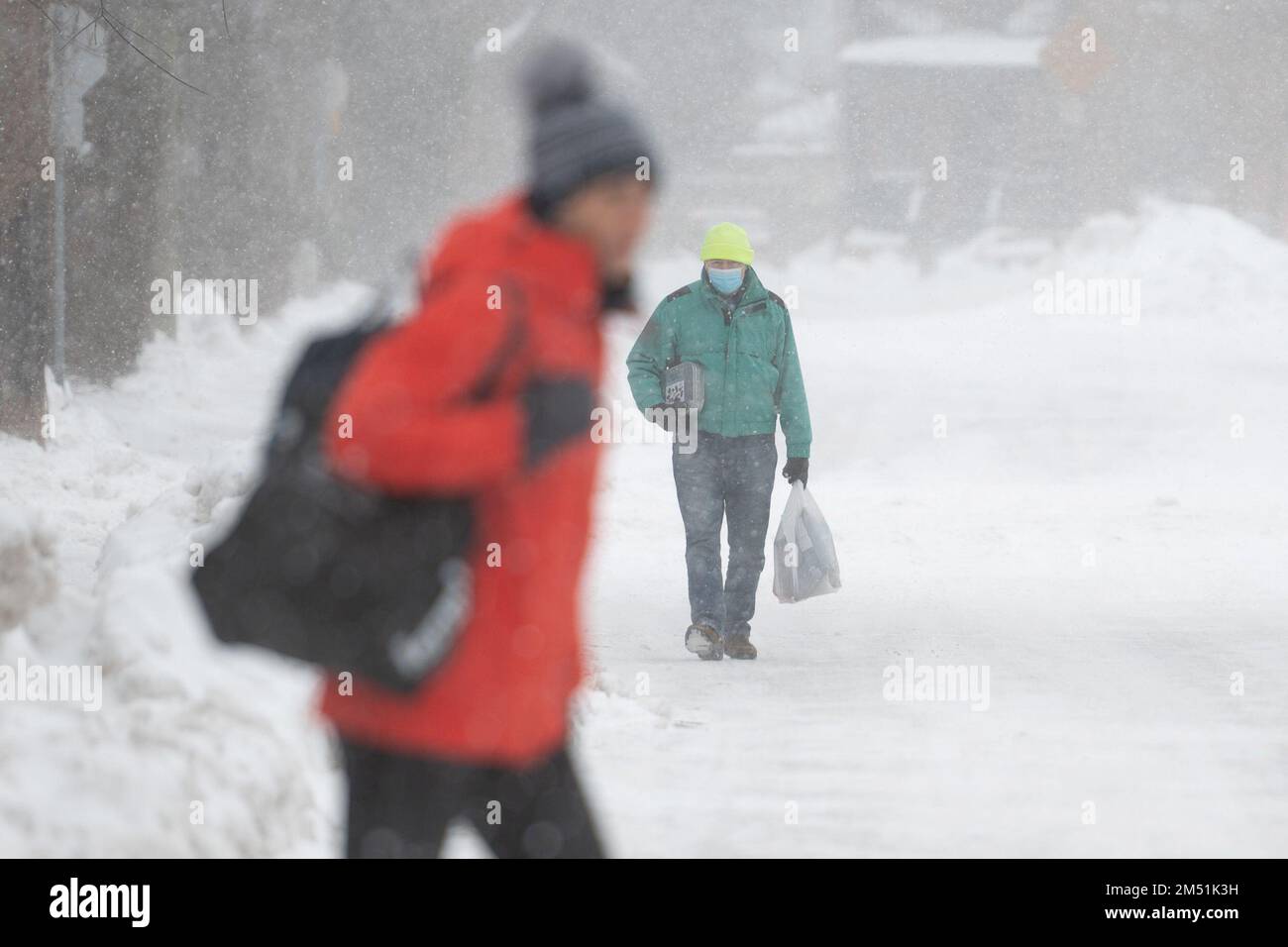 People make their way through the Glebe neighbourhood of Ottawa ...