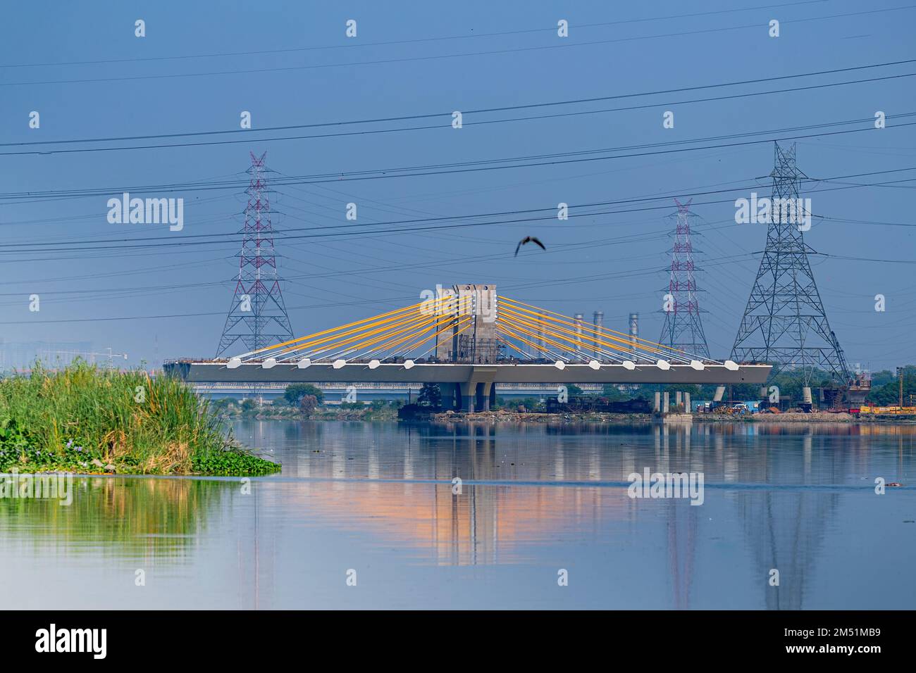 A metro bridge under construction over a river Stock Photo - Alamy