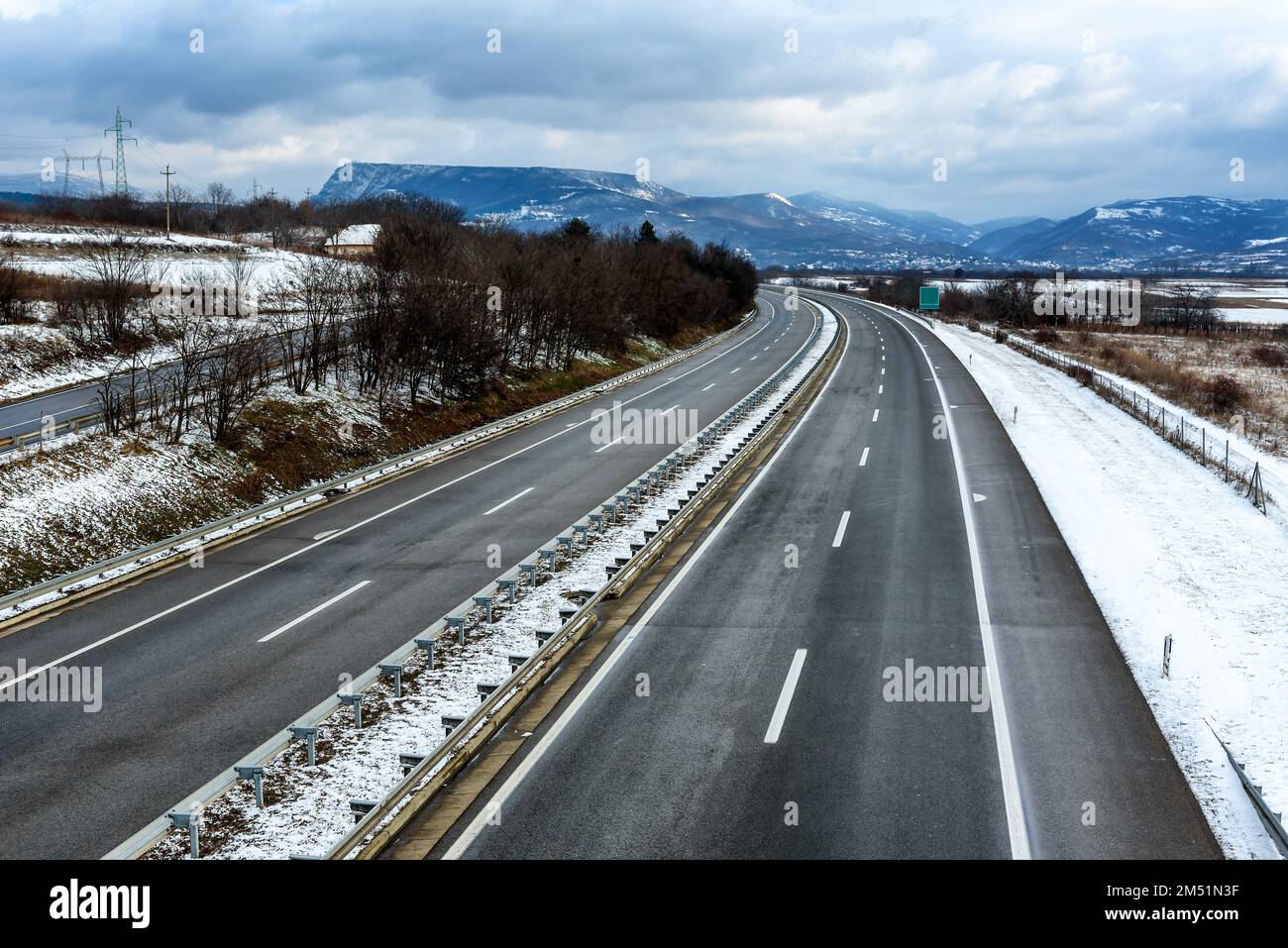 Silent freeway road in snowy winter season. Asphalt highway background ...