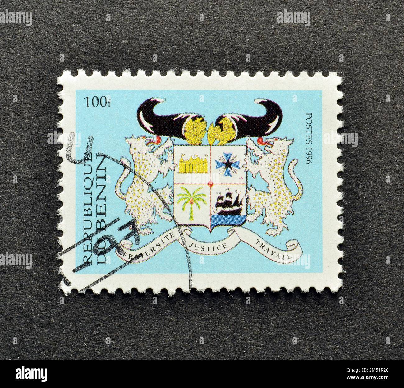 Cancelled postage stamp printed by Benin, that shows National Coat of ...