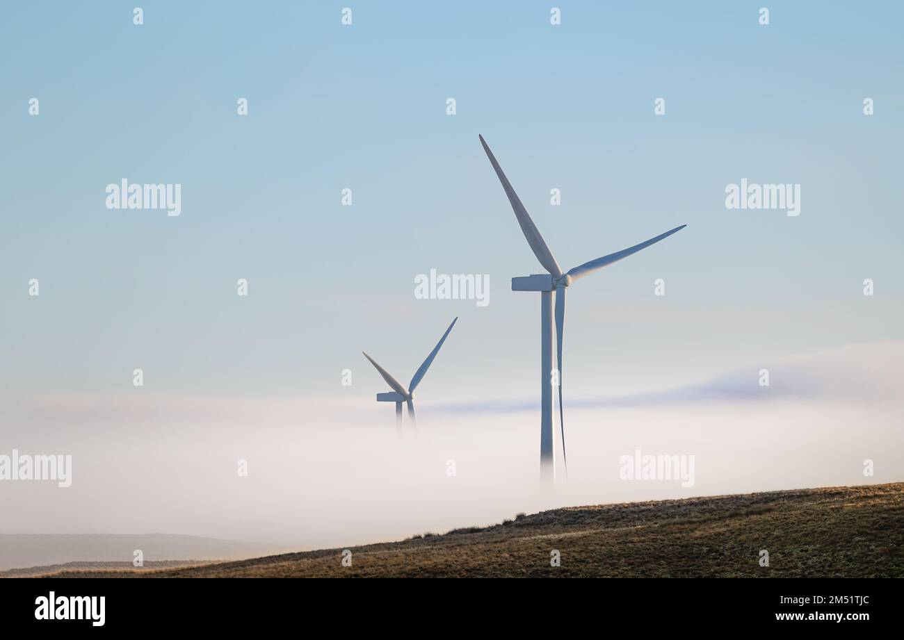 Wind Turbines in the mist in the hills of Northumberland, England Stock ...