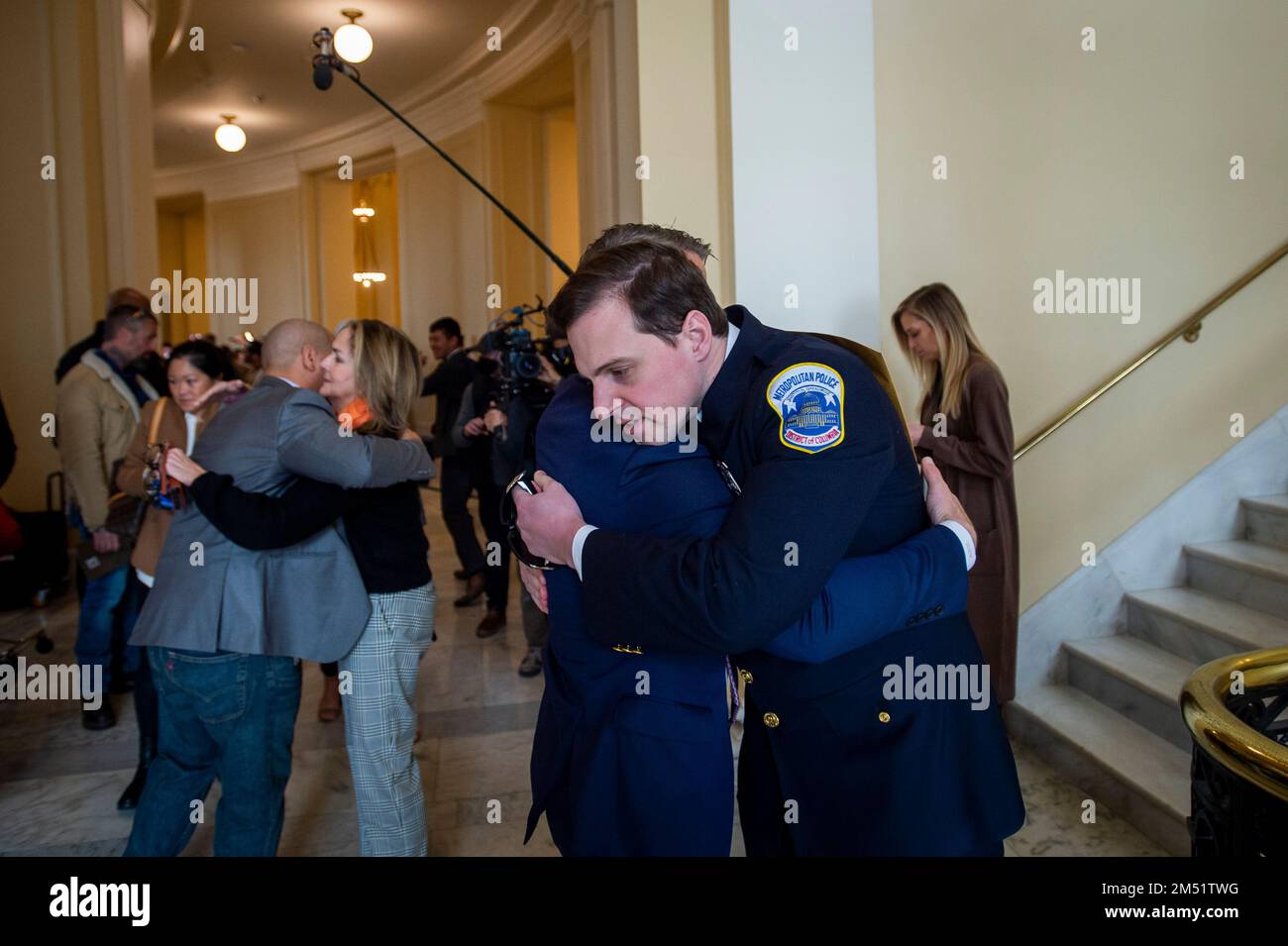 Former Capitol Police Sergeant Aquilino Gonell, left, is embraced by ...