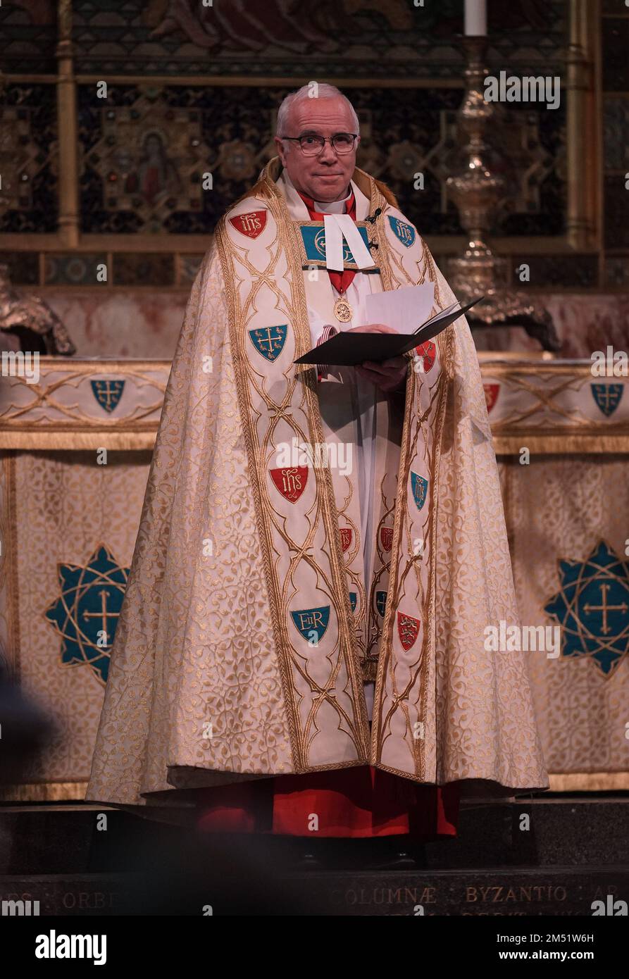 Dean of Westminster David Hoyle reading John 1: 1-5, 14, during the ...