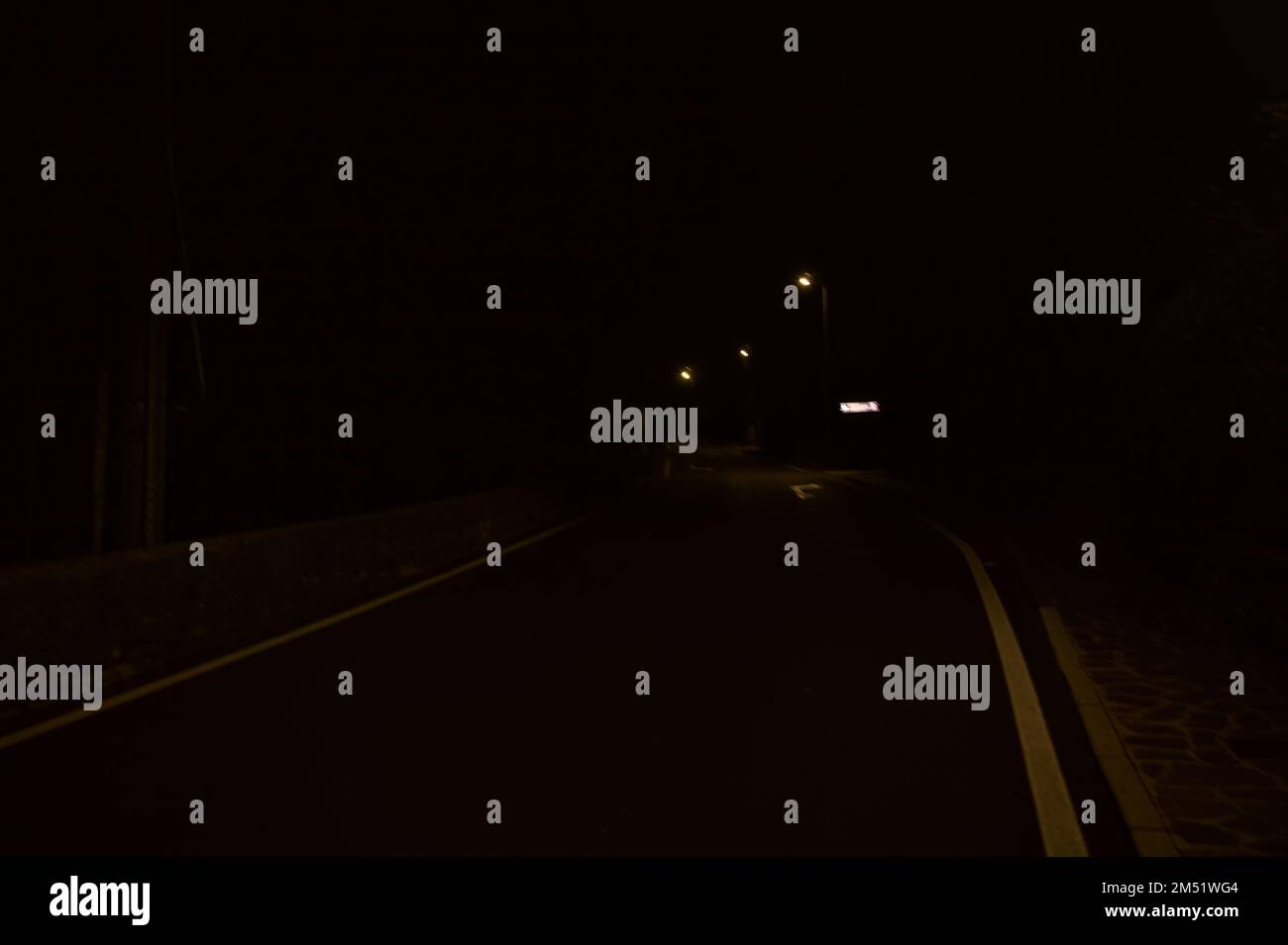 Country road with street lamps at night Stock Photo - Alamy