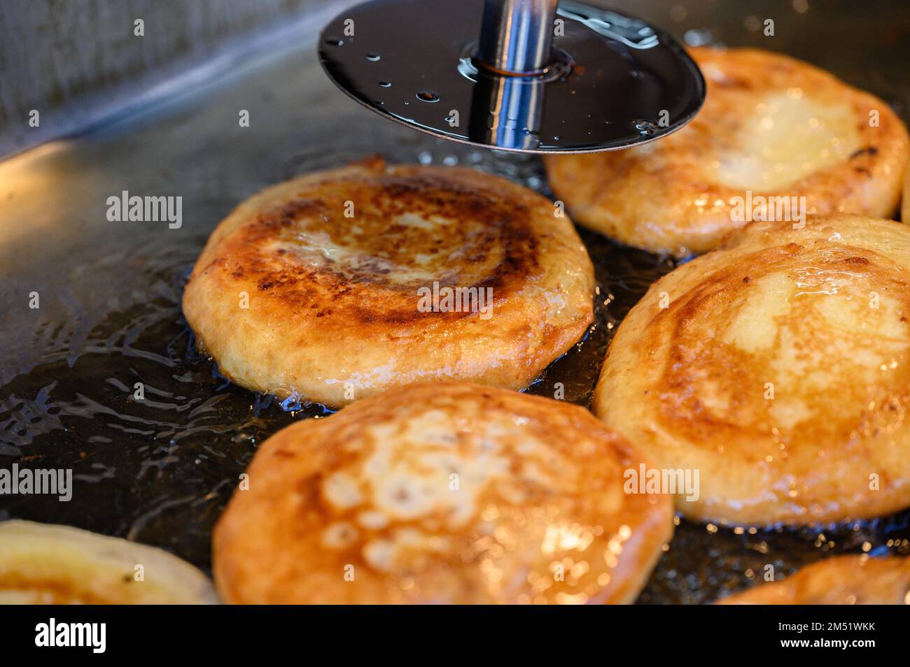 hotteok, Korean Syrup-filled Pancake : Fermented flour dough shaped ...