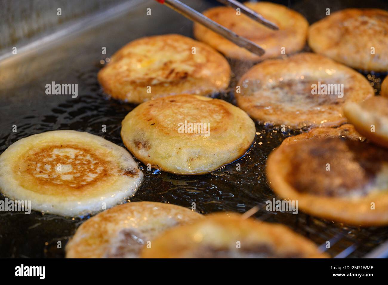 hotteok, Korean Syrup-filled Pancake : Fermented flour dough shaped ...