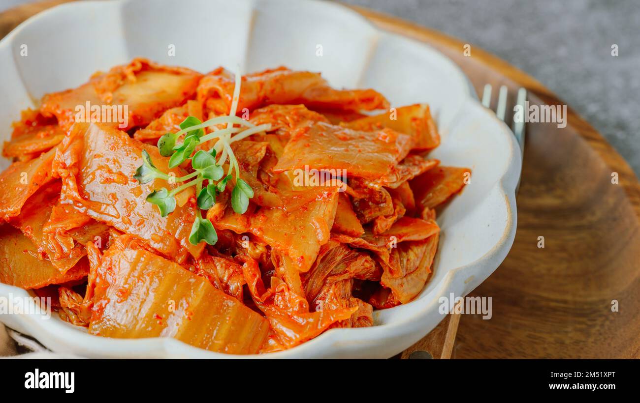 Well-fermented kimchi stir-fried with chopped green onion and garlic in ...