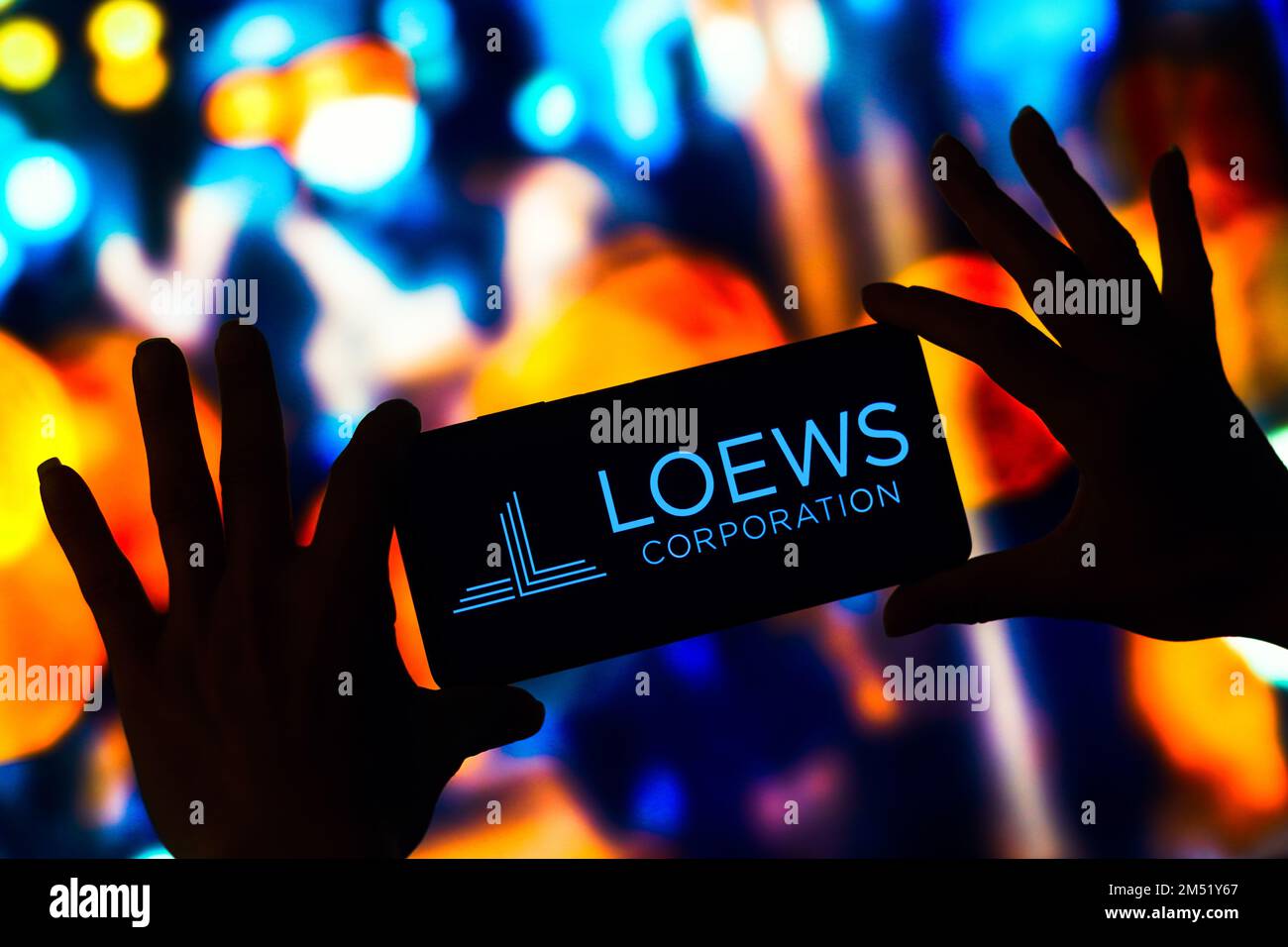In this photo illustration, the Loews Corporation logo is displayed on ...