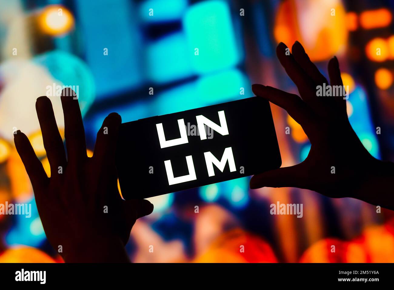 In this photo illustration, the Unum Group logo is displayed on a ...