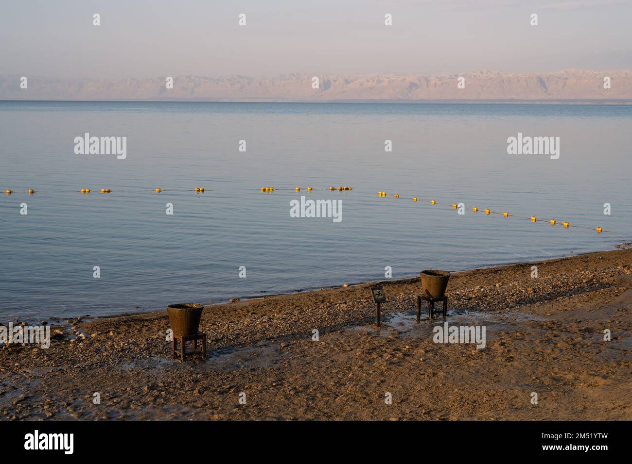 Dead Sea Beach with Buckets of Mud near Sweimeh, Jordan in the Morning ...