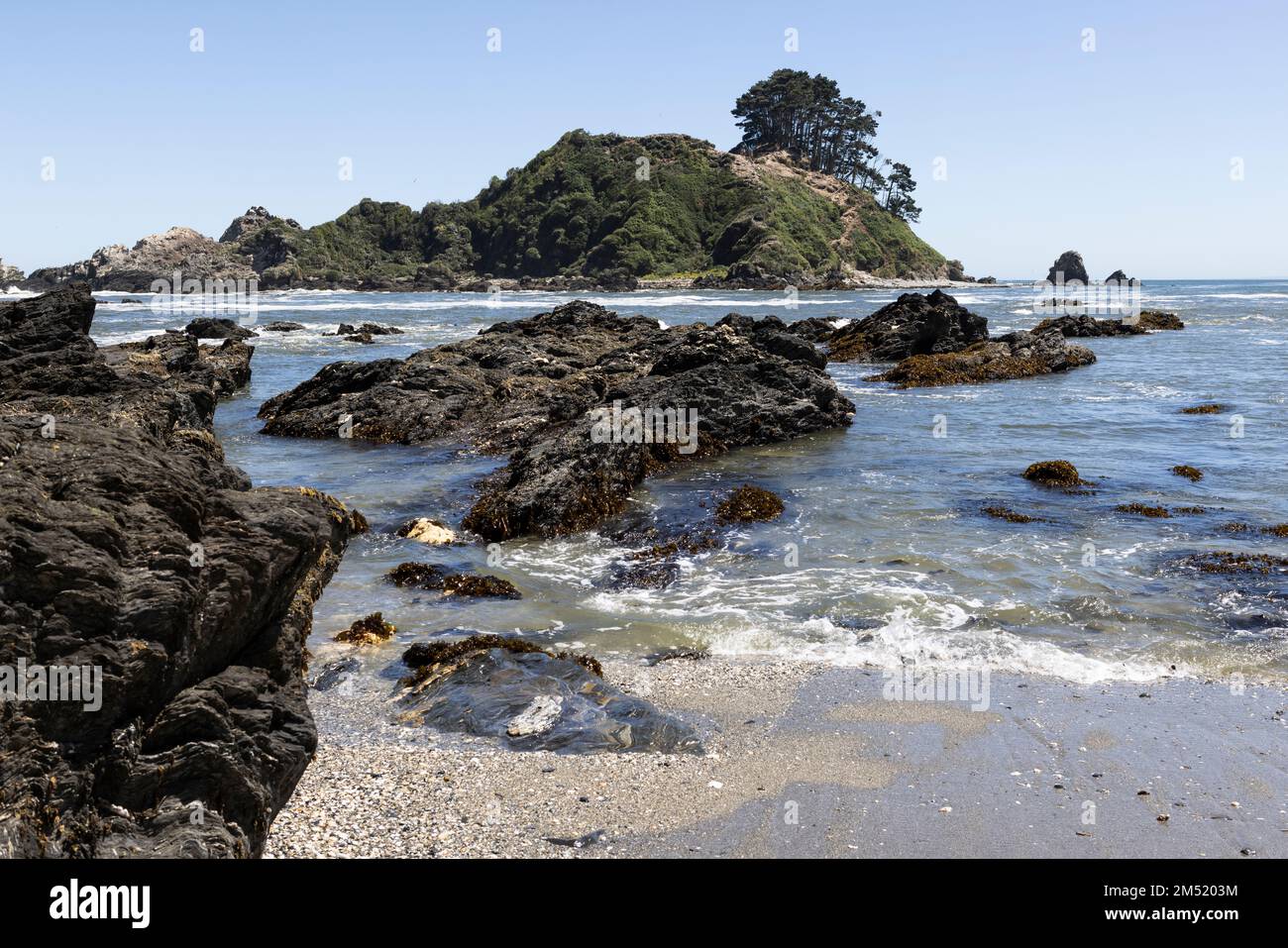 Isla Maiquillahue and big, serrated rocks in the Pacific Ocean of Chile ...
