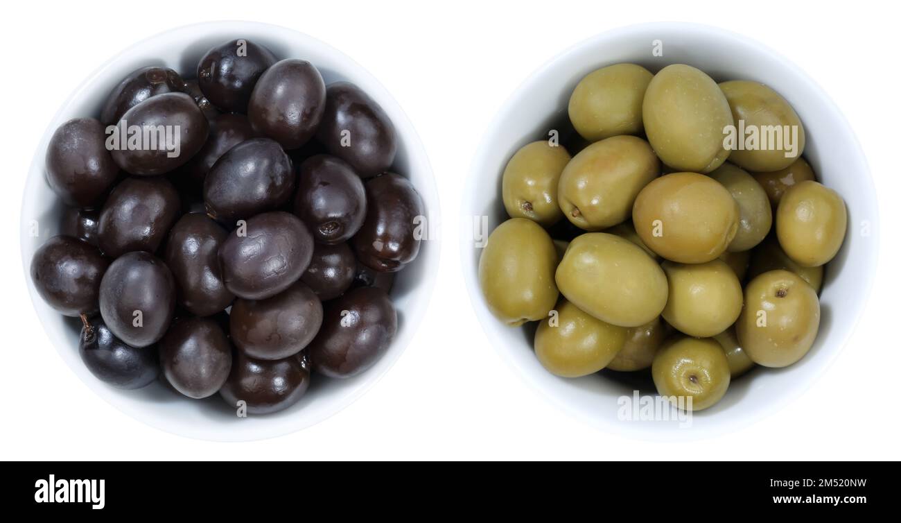 Black and green olives from above bowl isolated on a white background ...