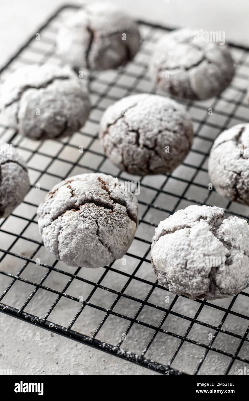 Chocolate chip cookies with cracks. Metallic rack with fresh baked ...