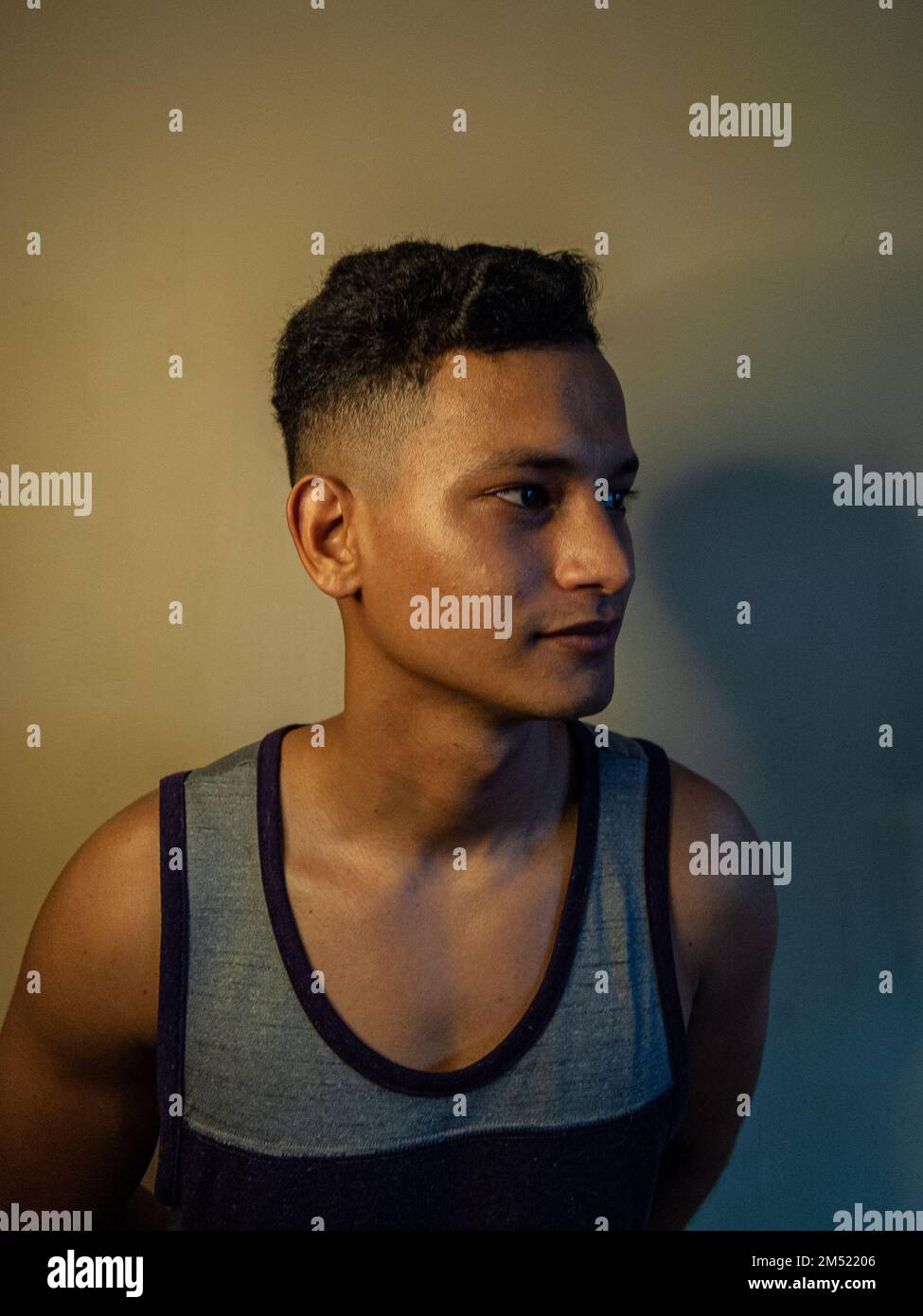 Latino man looking to the left Stock Photo - Alamy