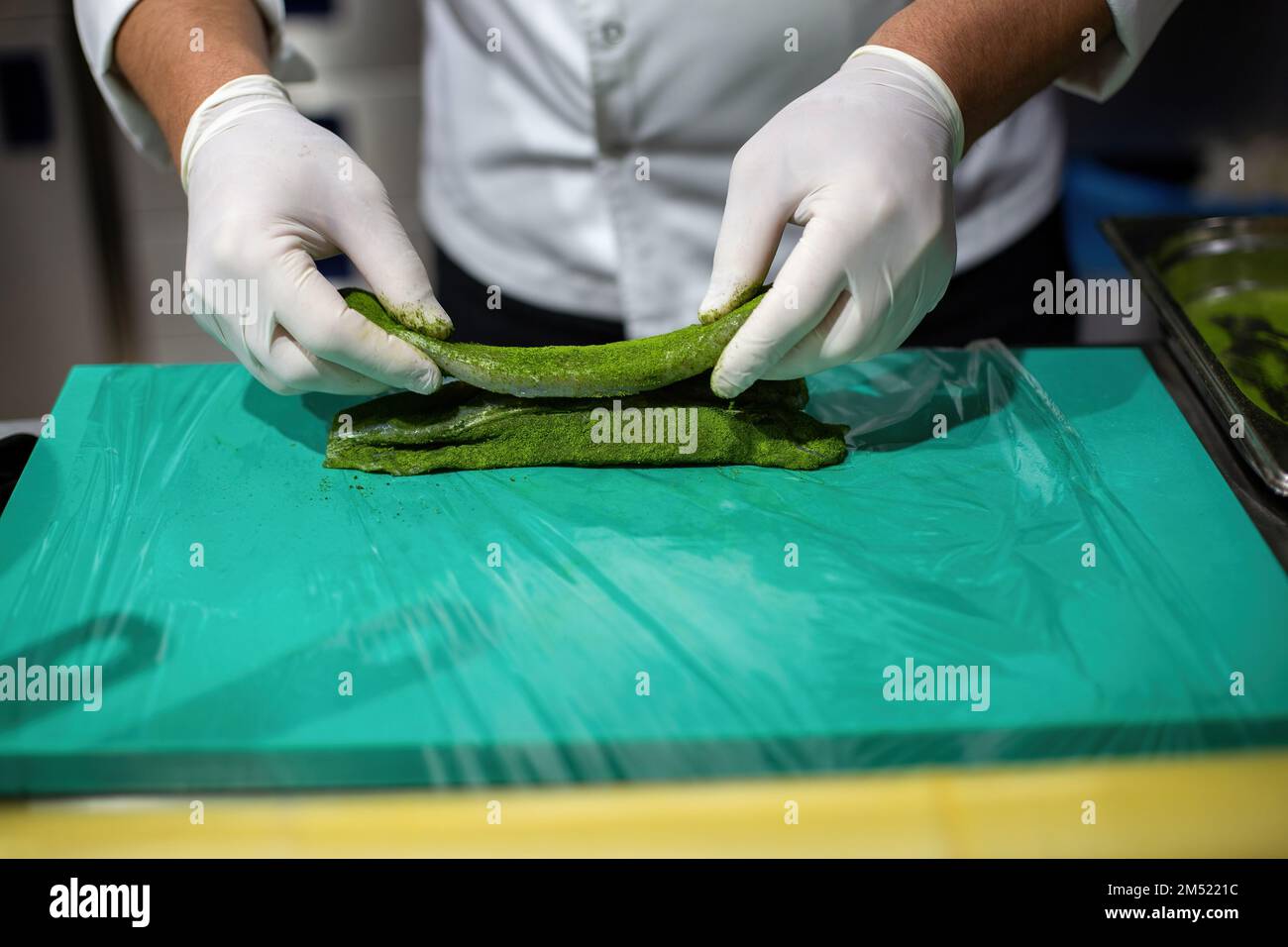 The chef cooking sole. Marinating fish with a mixture of 5 spices ...